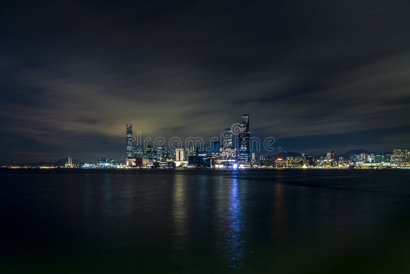 A Night View of the Kowloon Waterfront at Night with Boat Light Trails ...
