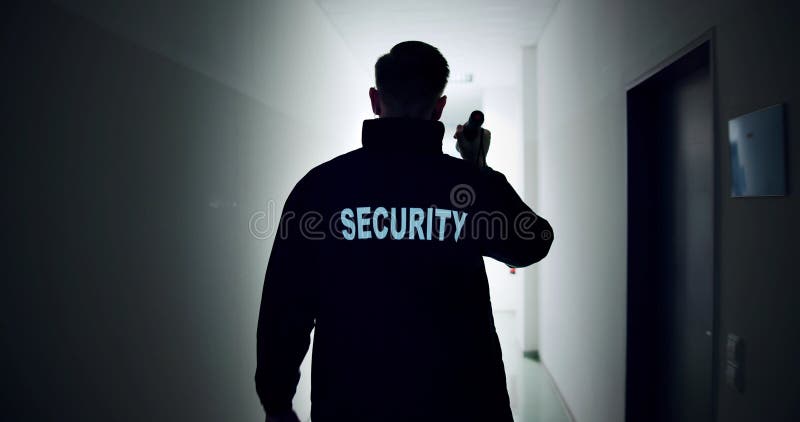 Night Warehouse Security Guard Patrols in Uniform with Flashlight Stock ...
