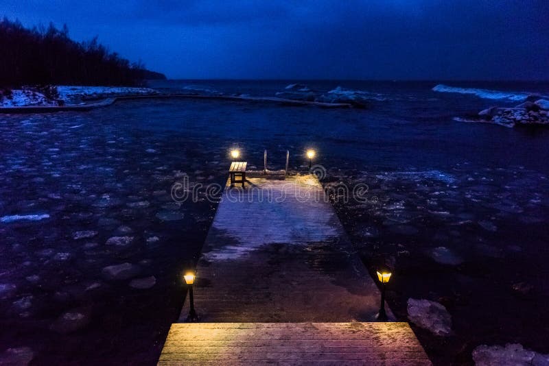 Night Winter Seascape with a Pier and Ice in the Water Stock Image ...