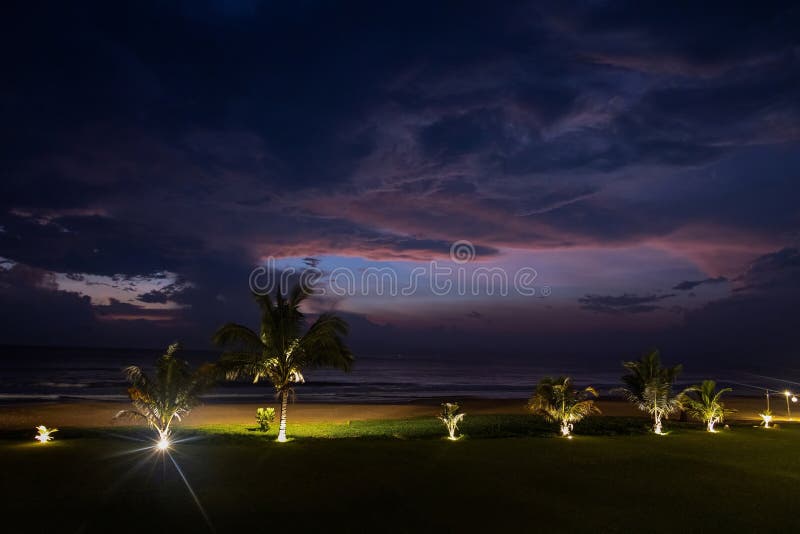 Nightfall Over Ventura Beach with Dramatic Clouds and Illuminated Palm ...