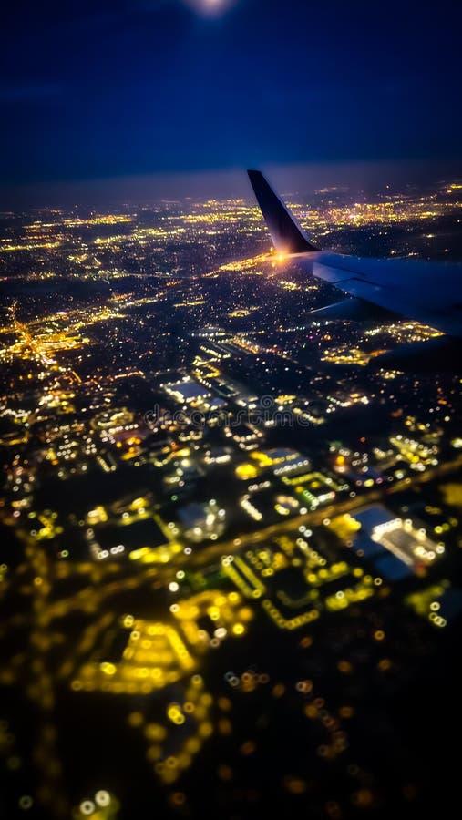 A Nighttime Aerial View from an Airplane Window, Capturing the Wing of ...
