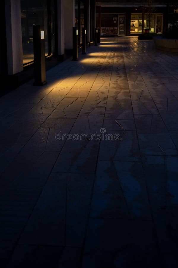 Nighttime Imge of Street Lighting Reflecting on Pavement or Sidewalk ...
