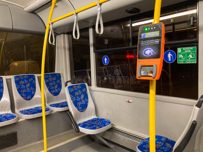 Nighttime Interior of a Bus Featuring Rows of Patterned Seats, Yellow ...