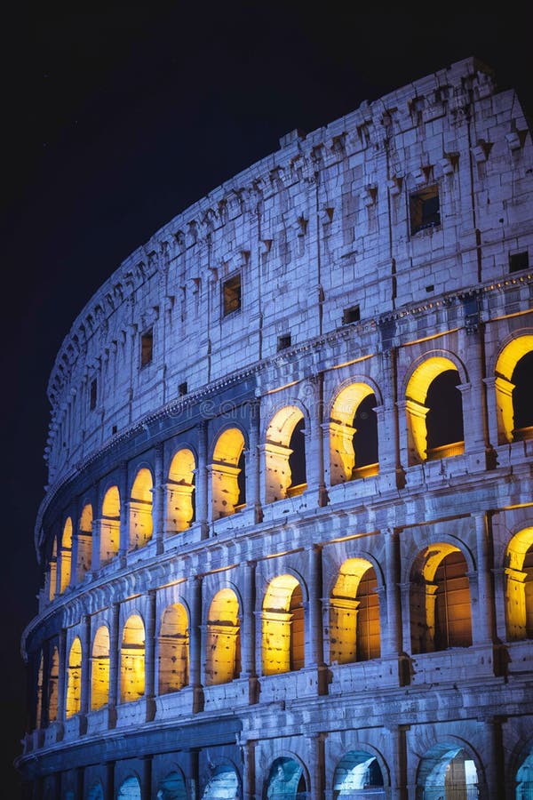 Nighttime Photo of the Colosseum in Rome with Partial Illumination ...
