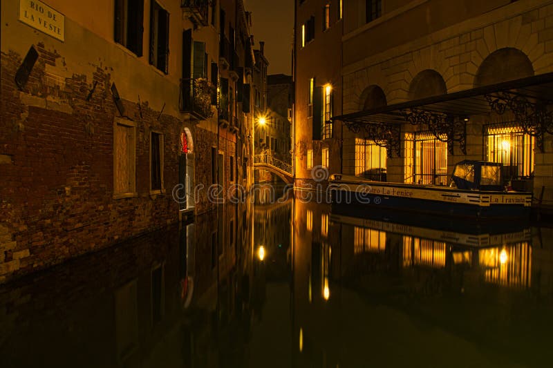 Nighttime Waterway with Boats Afloat Stock Photo - Image of illuminated ...