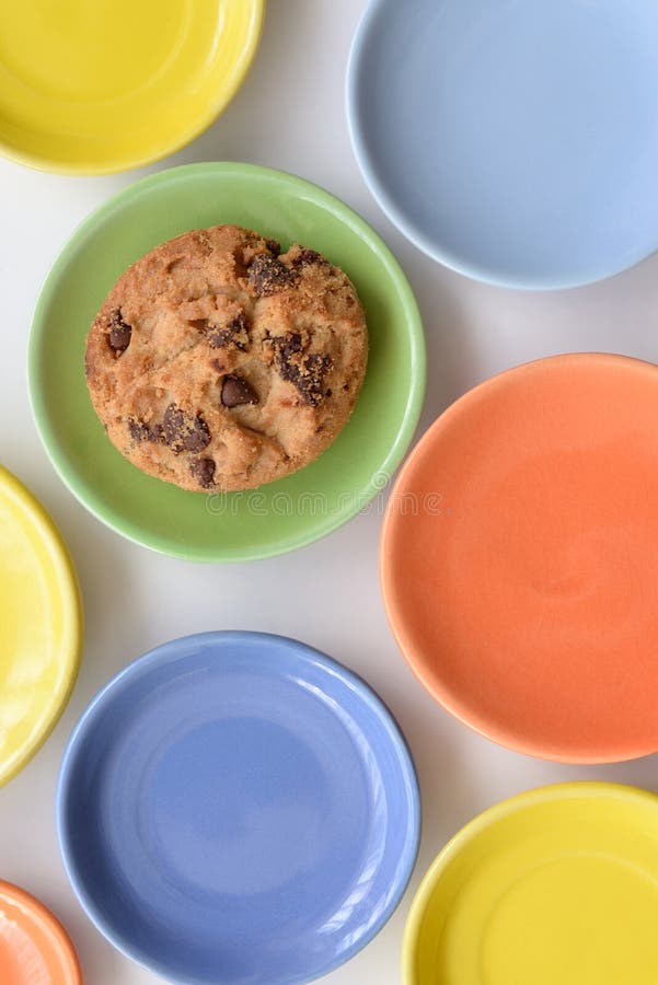 Cookie with Chocolate Chips Surrounded with Empty Plates Stock Photo ...