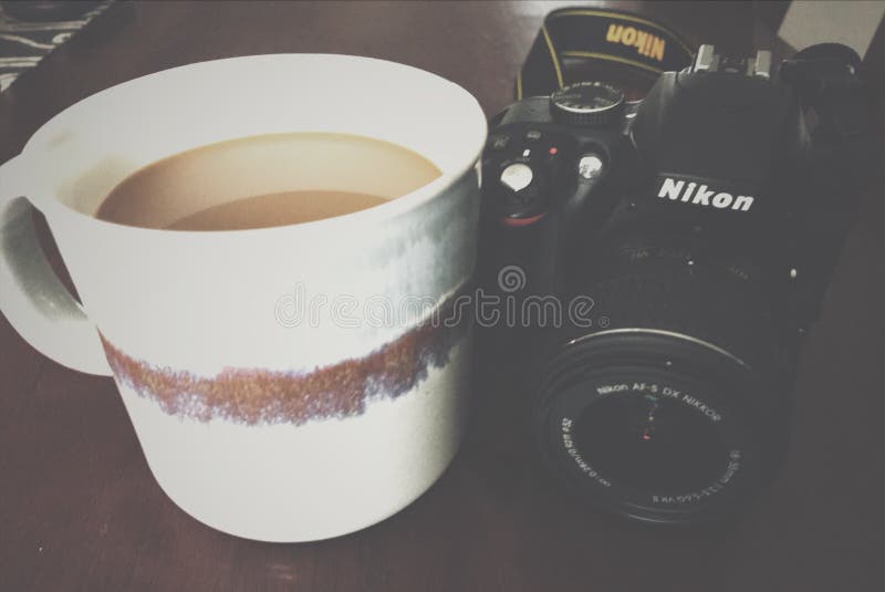 NIKON CAMERA and COFFEE editorial photography. Image of nikon - 130187517