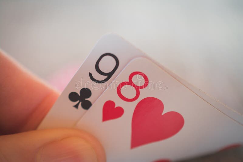 Nine and Eight, Playing Cards in Hand on the Table, Poker Nands Stock ...
