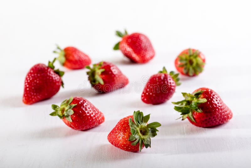 Nine Juicy Strawberry on the Table Stock Photo - Image of leaf ...