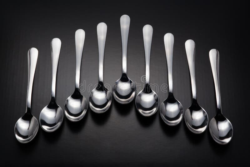 Nine Stainless Steel Spoons on Black Background. Stock Photo - Image of ...