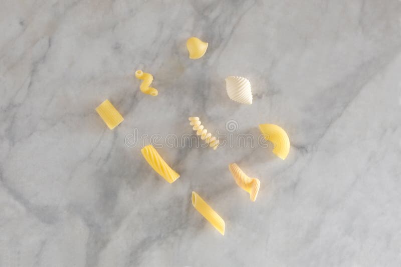Nine Types of Different Pasta Rest on a Marble Table with Copy Space ...