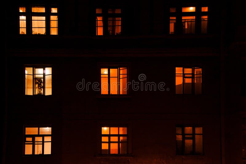 Nine Lighted Windows in the Night Stock Image - Image of facade, brown ...