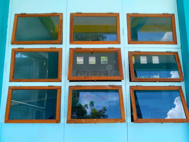 Nine Windows on a Light Blue Wall Stock Image - Image of windows, nine ...