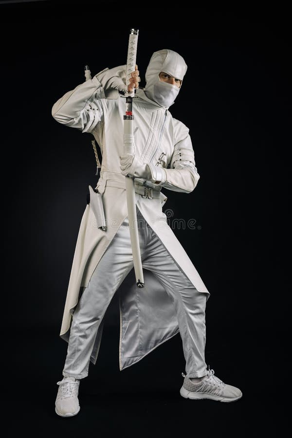 Ninja Posing for a Photo on a Black Background, a Male Ninja in a White ...