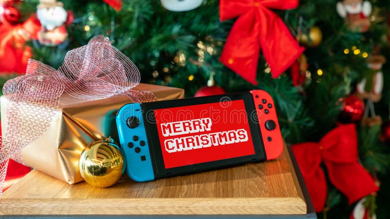Nintendo Switch with Merry Christmas Message and a Christmas Tree in ...