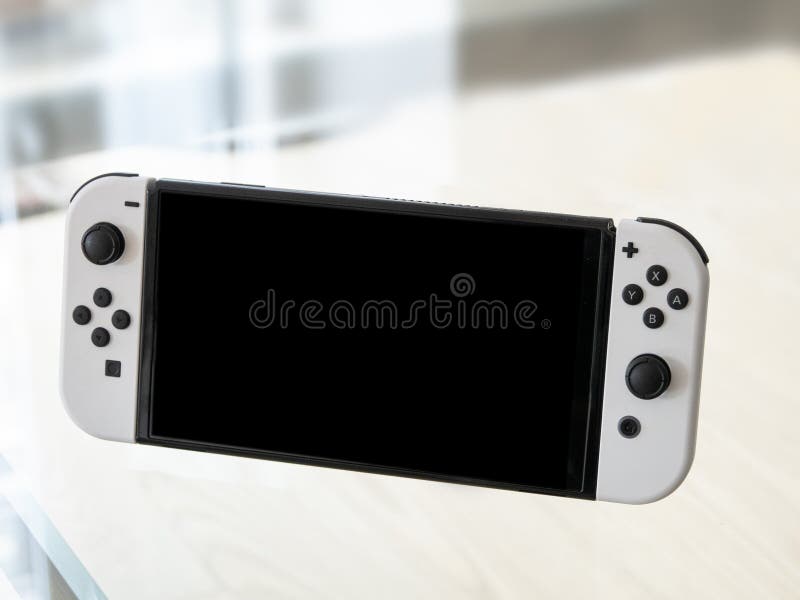 Nintendo Switch OLED Model in Handheld Mode. Popular Mobile Gaming ...
