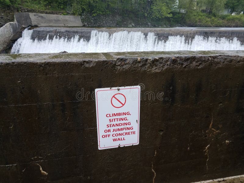 No Climbing Sitting or Standing or Jumping Off Wall Sign and Waterfall ...