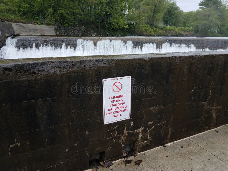 No Climbing Sitting or Standing or Jumping Off Wall Sign and Waterfall ...