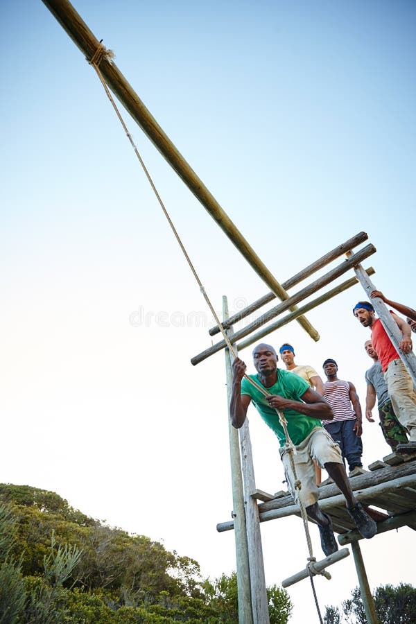 No Fear. a Group of Men Going through an Obstacle Course at Bootcamp ...