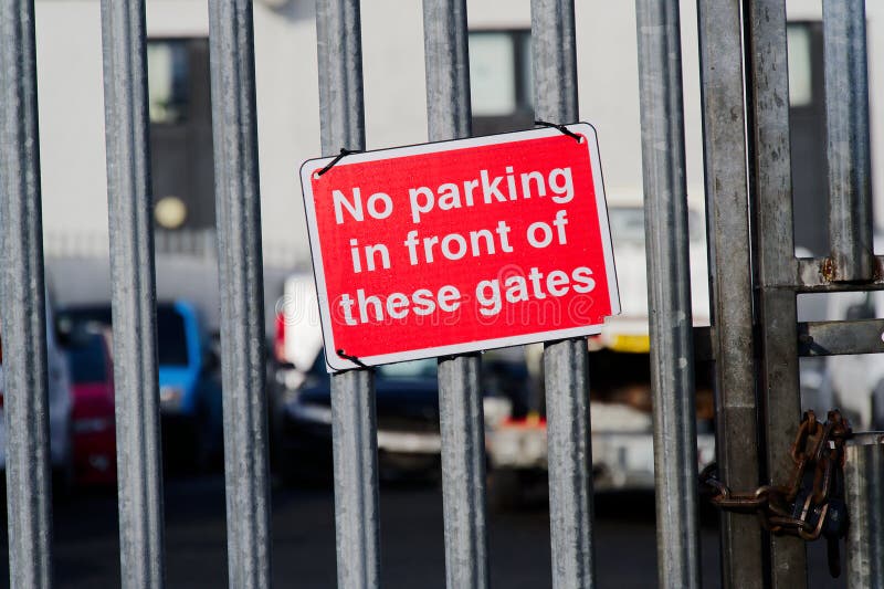 No Parking in Front of these Gates Sign Stock Image - Image of cars ...