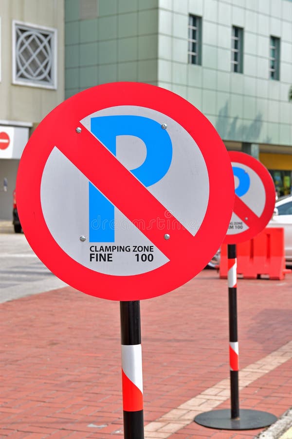 No Parking Sign with Fine Warning Stock Photo - Image of black, high ...