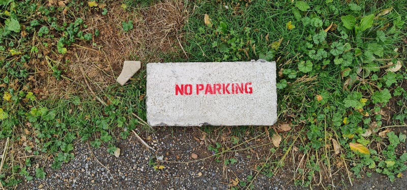 No Parking Sign Printed on a Stone Stock Image - Image of printed, east ...