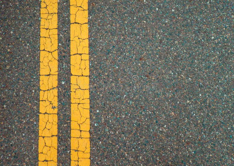 Look Down at a Street with Double Yellow Lines on Asphalt Stock Photo ...
