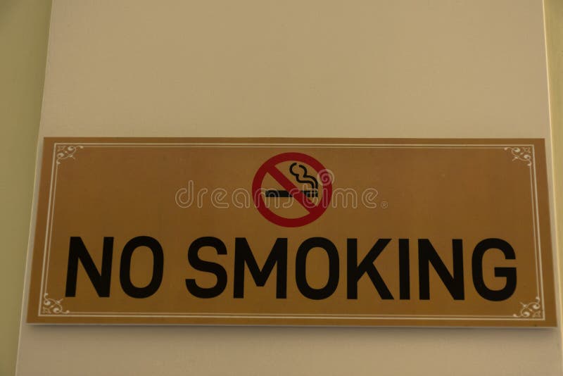 A No Smoking Sign Board on Wall Stock Photo - Image of tobacco, symbol ...
