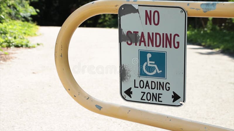 No Standing Loading Zone with Handicap Symbol and Two Arrows Pointing ...