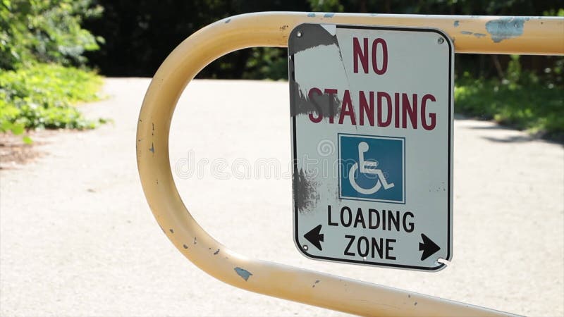 No Standing Loading Zone with Handicap Symbol and Two Arrows Pointing ...