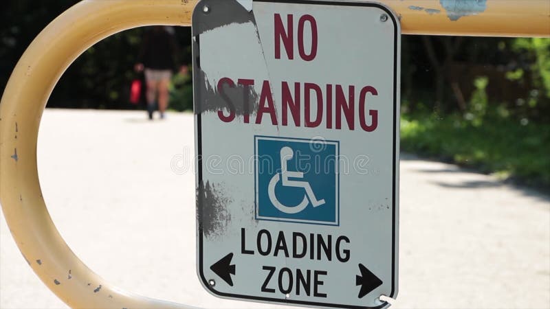 No Standing Loading Zone with Handicap Symbol and Two Arrows Pointing ...
