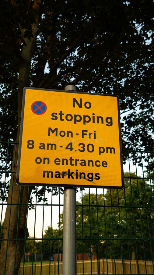 No Stopping Monday To Friday on Entrance School Markings Stock Photo ...