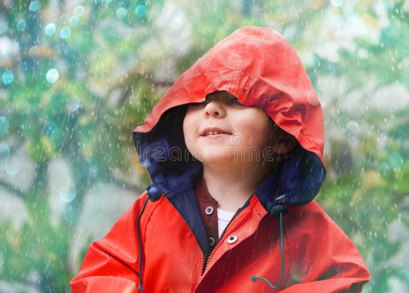 No Sun, No Problem. an Adorable Little Boy Playing Outside in the Rain ...
