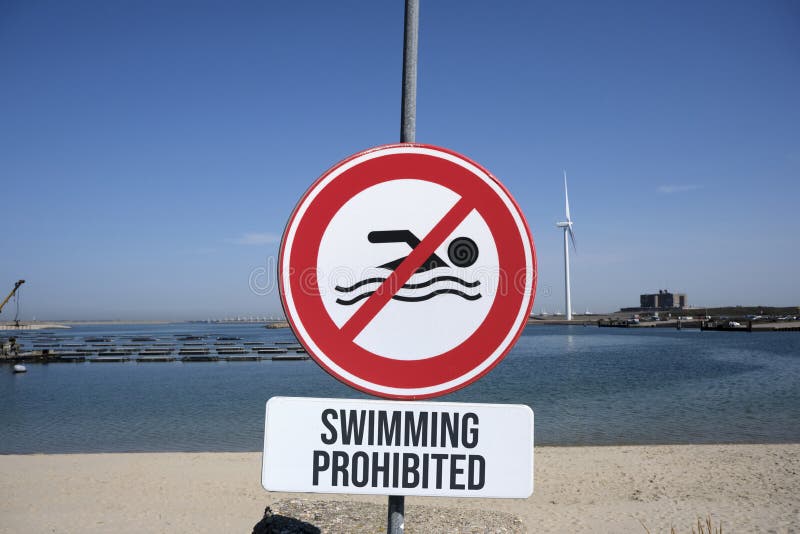 A No Swimming Danger Sign at the Beach Stock Photo - Image of blue ...