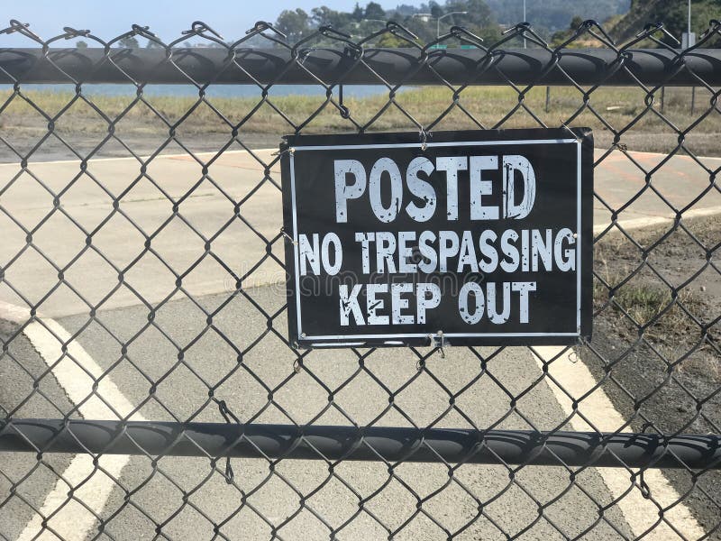 No Trespassing Keep Out Sign Along The Fence Stock Photo - Image of ...