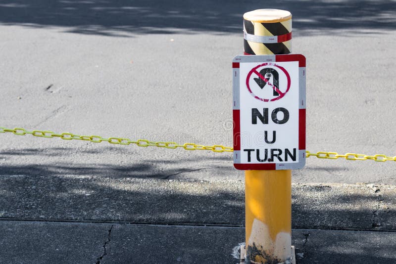 No U-Turn sign on a post stock image. Image of street - 148095055