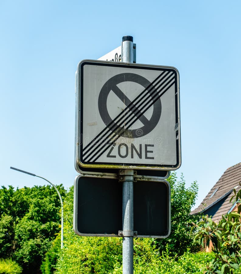 A No Zone Sign is on a Pole in Front of a House Stock Photo - Image of ...