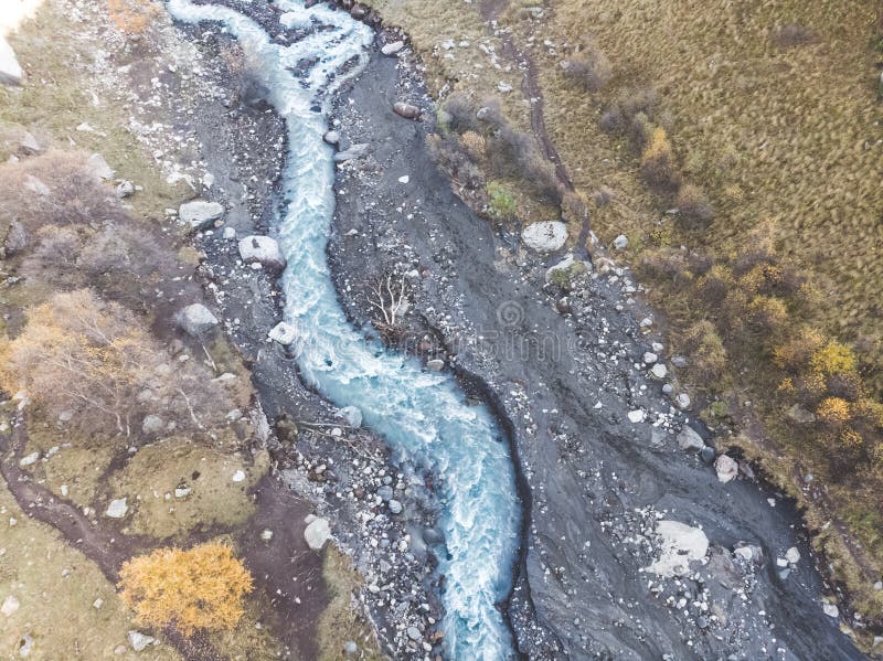 Noisy Fast Mountain River Flows Rapidly through the Valley, Top View ...