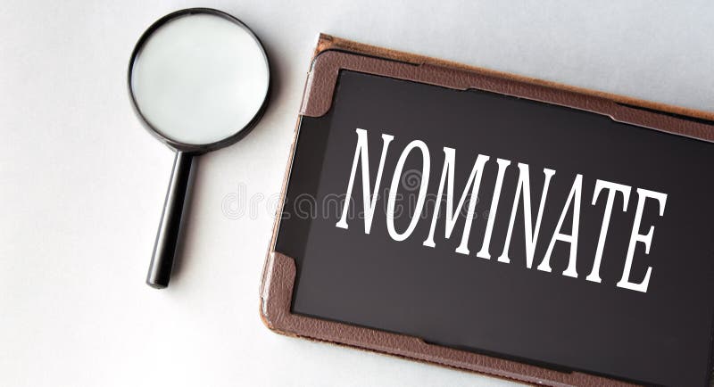 NOMINATE - Word in Electronic Notebook on White Background with ...