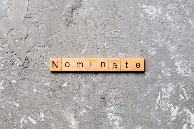 Nominate Word Written on Wood Block. Nominate Text on Table, Concept ...
