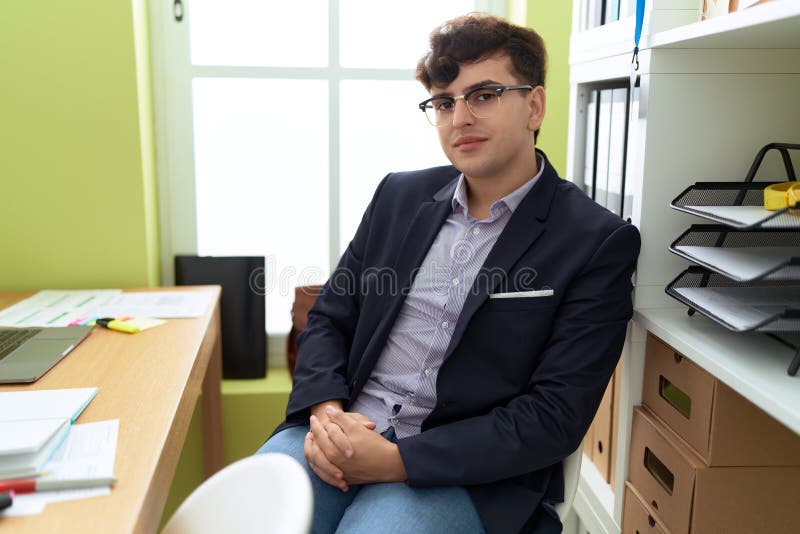 Non Binary Man Business Worker Smiling Confident Sitting on Table at ...