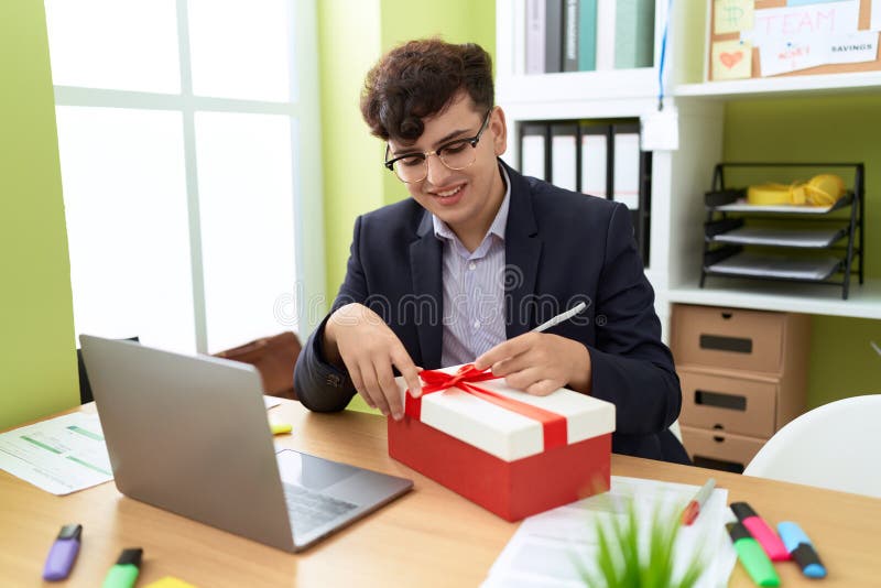 Non Binary Man Business Worker Unpacking Gift at Office Stock Photo ...