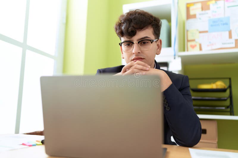 Non Binary Man Business Worker Using Laptop with Relaxed Expression at ...