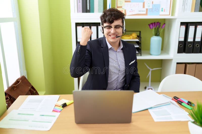 Non Binary Man Call Center Agent Working with Winner Expression at ...