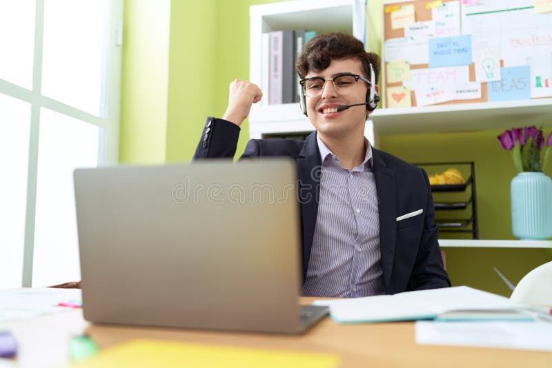 Non Binary Man Call Center Agent Working with Winner Expression at ...