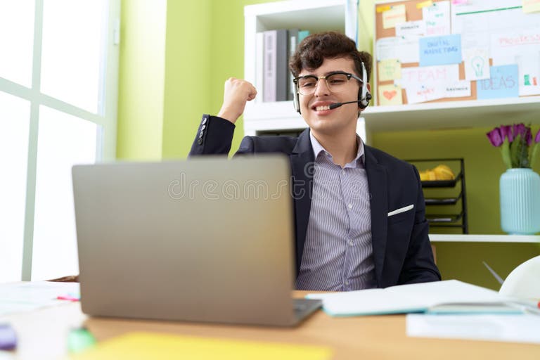 Non Binary Man Call Center Agent Working with Winner Expression at ...