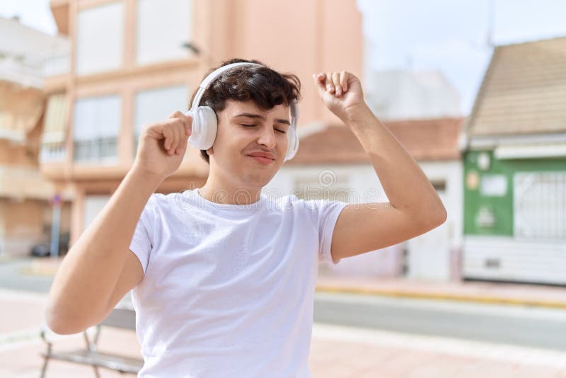 Non Binary Man Listening To Music and Dancing at Street Stock Photo ...