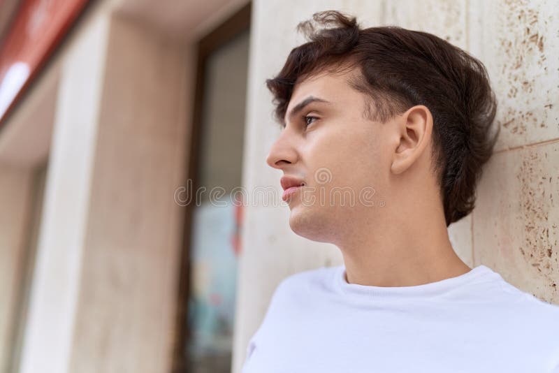 Non Binary Man Looking To the Side with Serious Expression at Street ...