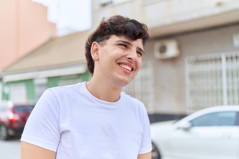 Non Binary Man Smiling Confident Looking To the Side at Street Stock ...