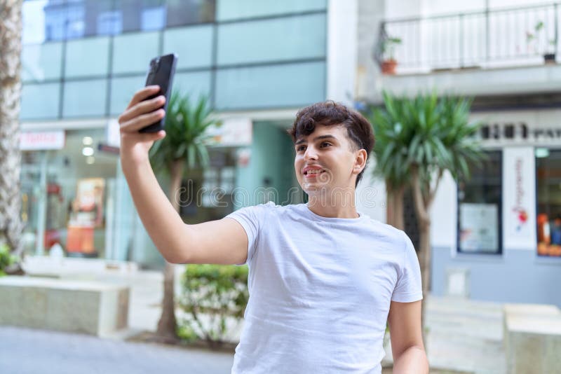 Non Binary Man Smiling Confident Making Selfie by the Smartphone at ...